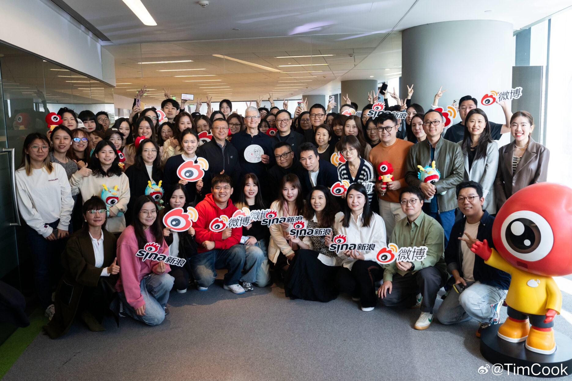 Why did Tim Cook visit a farm in Beijing, China?